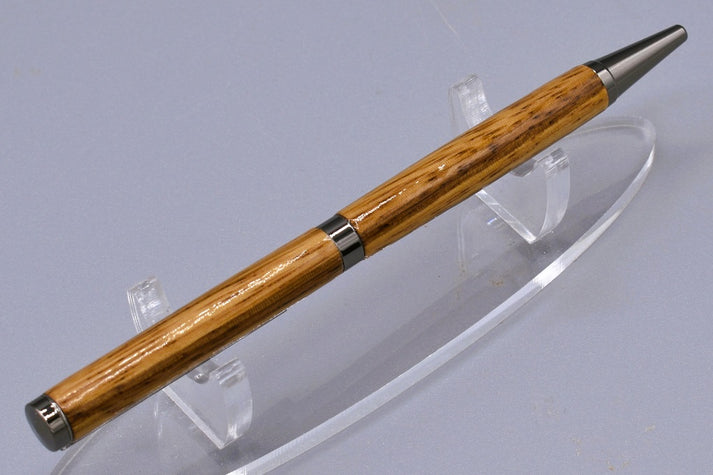 Handmade Slim twist pen. Zebra wood – Grumpy Guy Pens